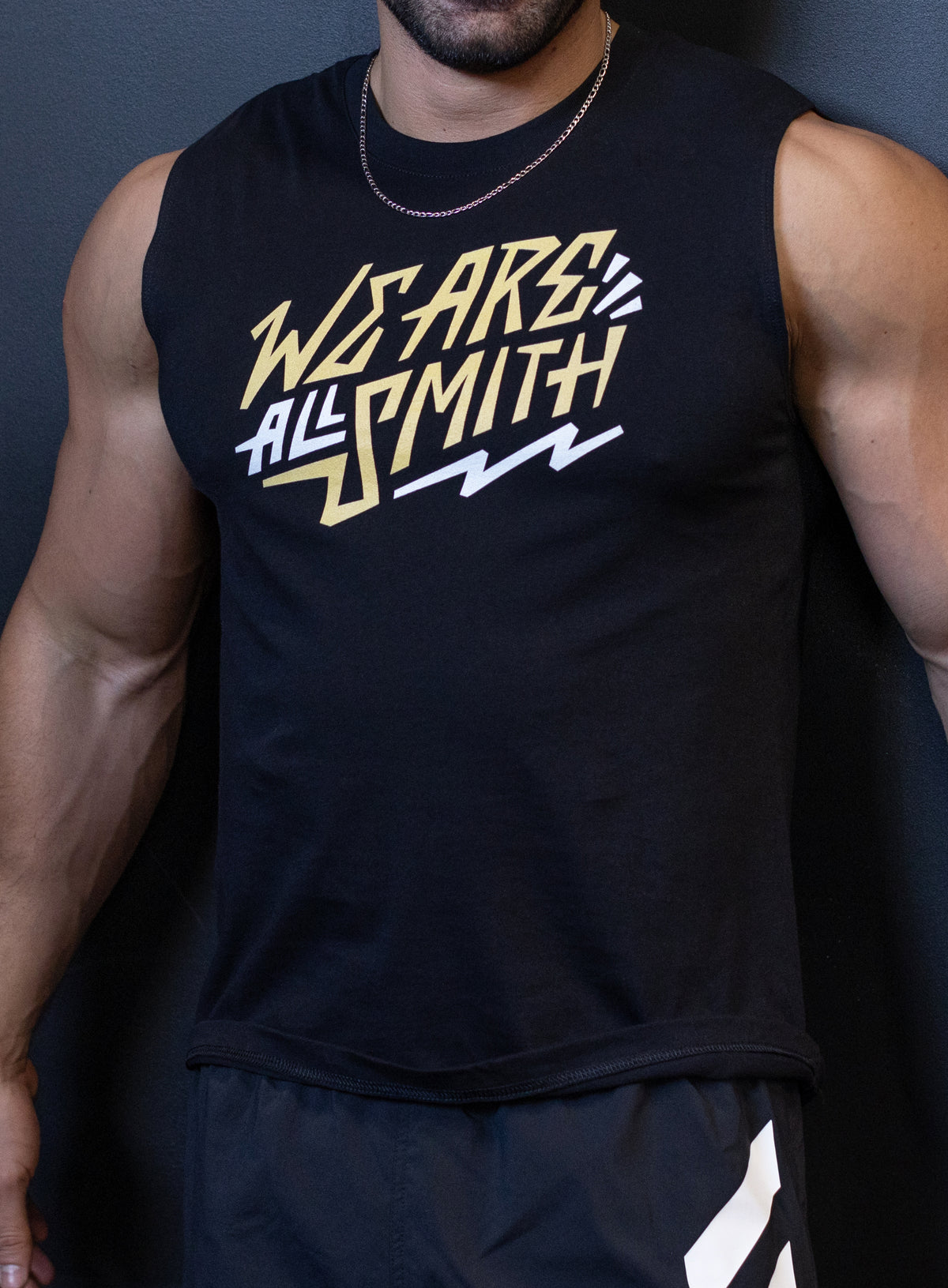 We Are All Smith Yellow Logo Black Muscle Shirt — WE ARE ALL SMITH