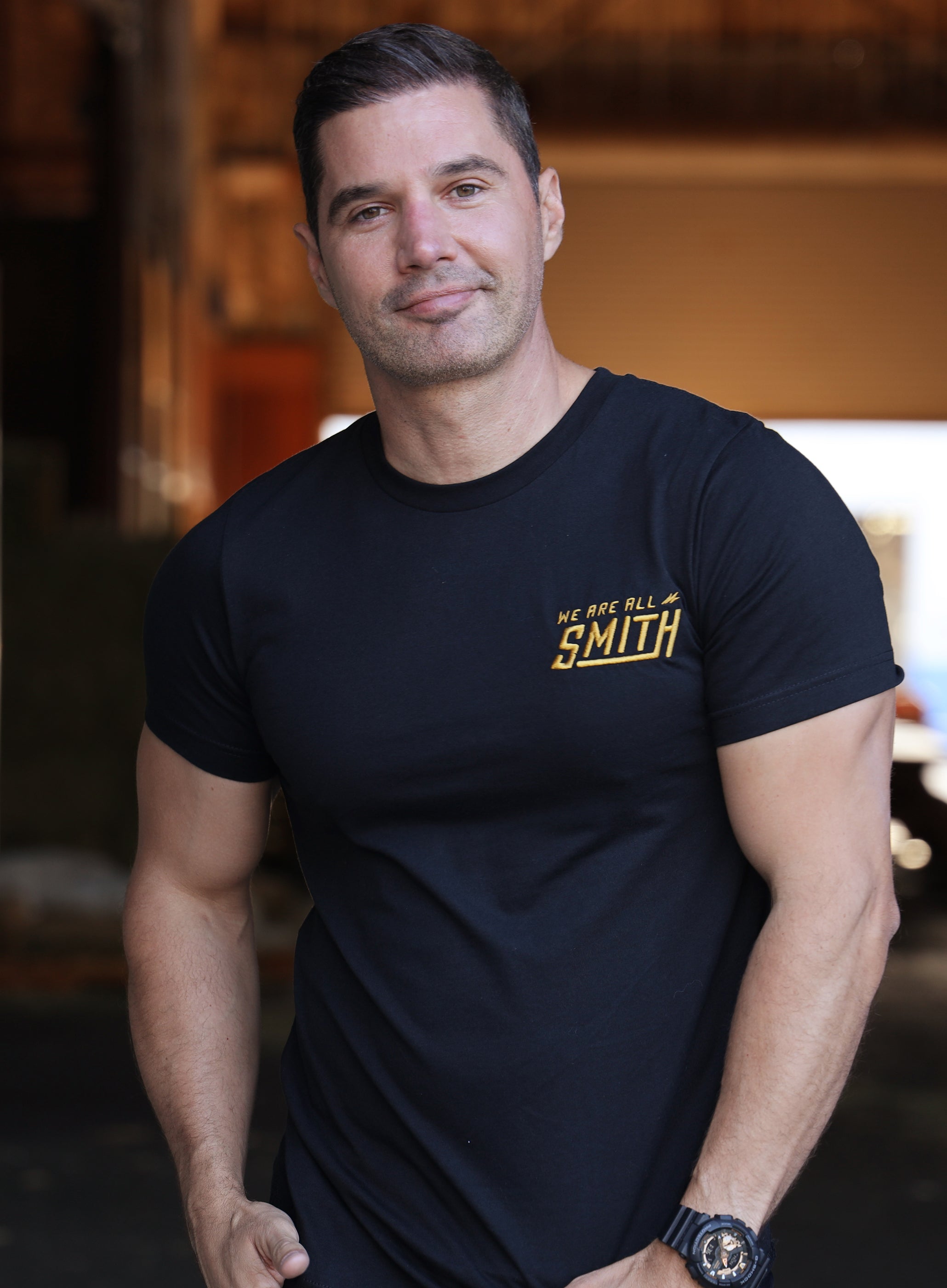 Gold We Are All Smith Embroidered Logo Black Unisex t-shirt — WE ARE ALL SMITH