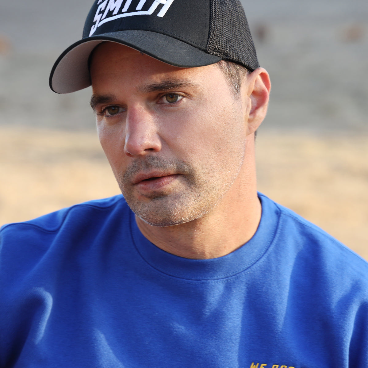 Closed-back black We Are All Smith trucker cap — WE ARE ALL SMITH